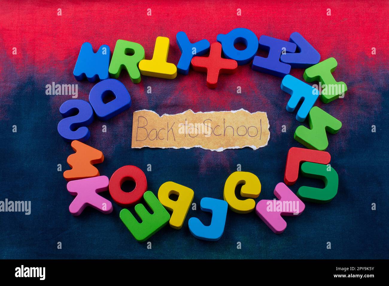 Back to school wording on a piece of torn paper Stock Photo - Alamy