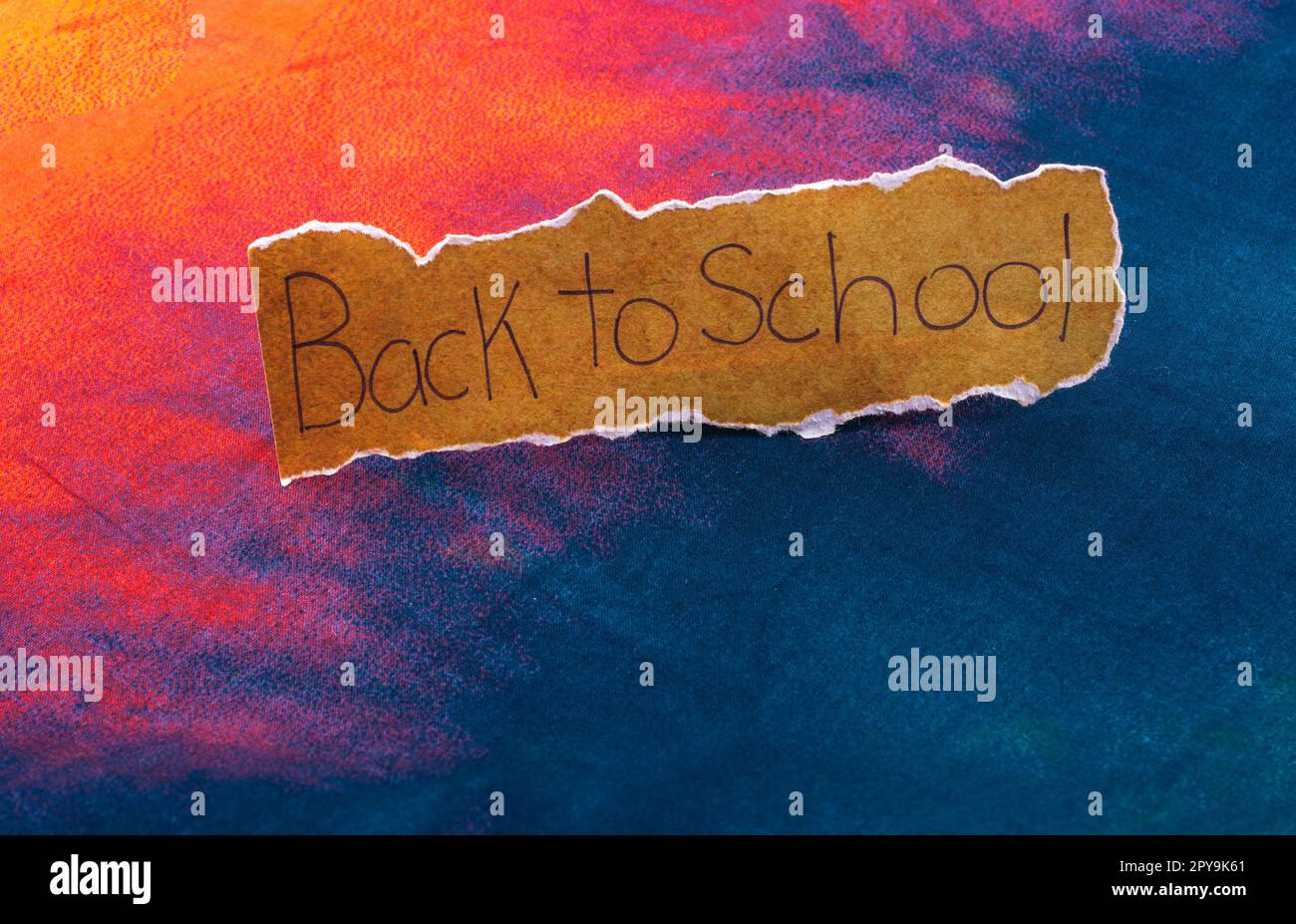 Back to school wording on a piece of torn paper Stock Photo - Alamy