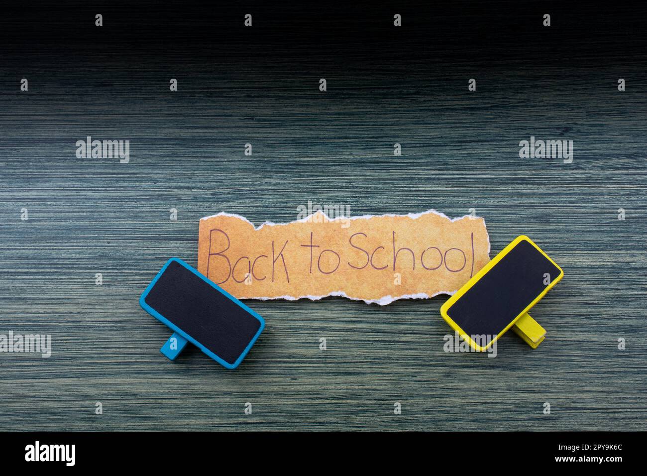 Back to school wording on a piece of torn paper Stock Photo - Alamy