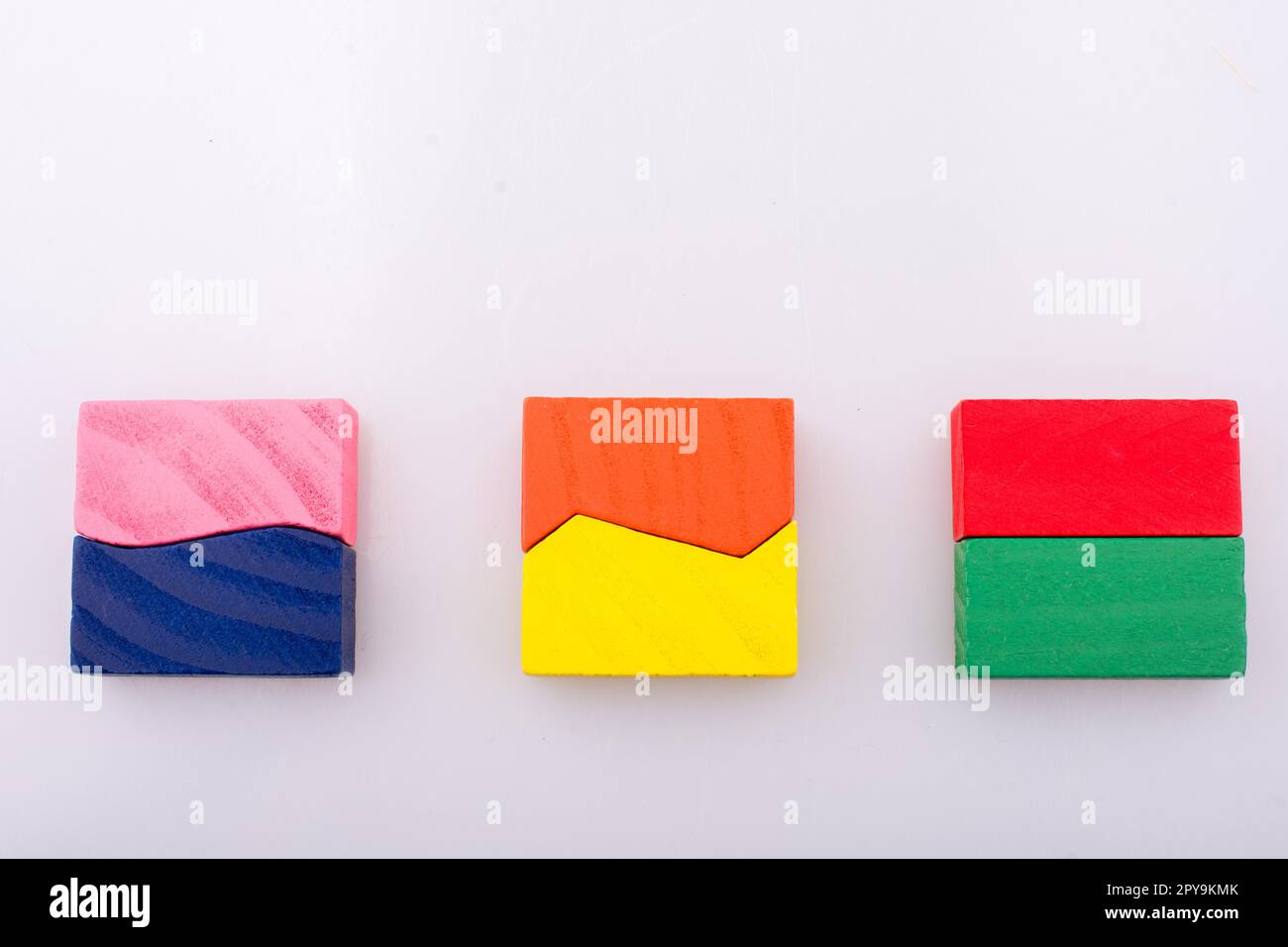 Colorful wooden pieces of a logic puzzle Stock Photo - Alamy