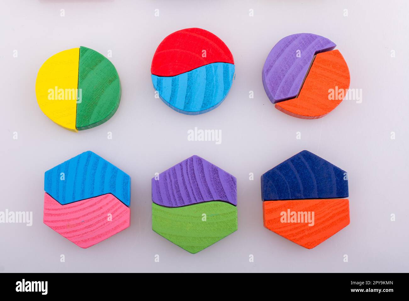 Colorful wooden pieces of a logic puzzle Stock Photo - Alamy