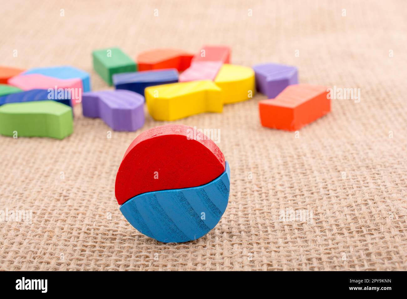 Colorful wooden pieces of a logic puzzle Stock Photo - Alamy