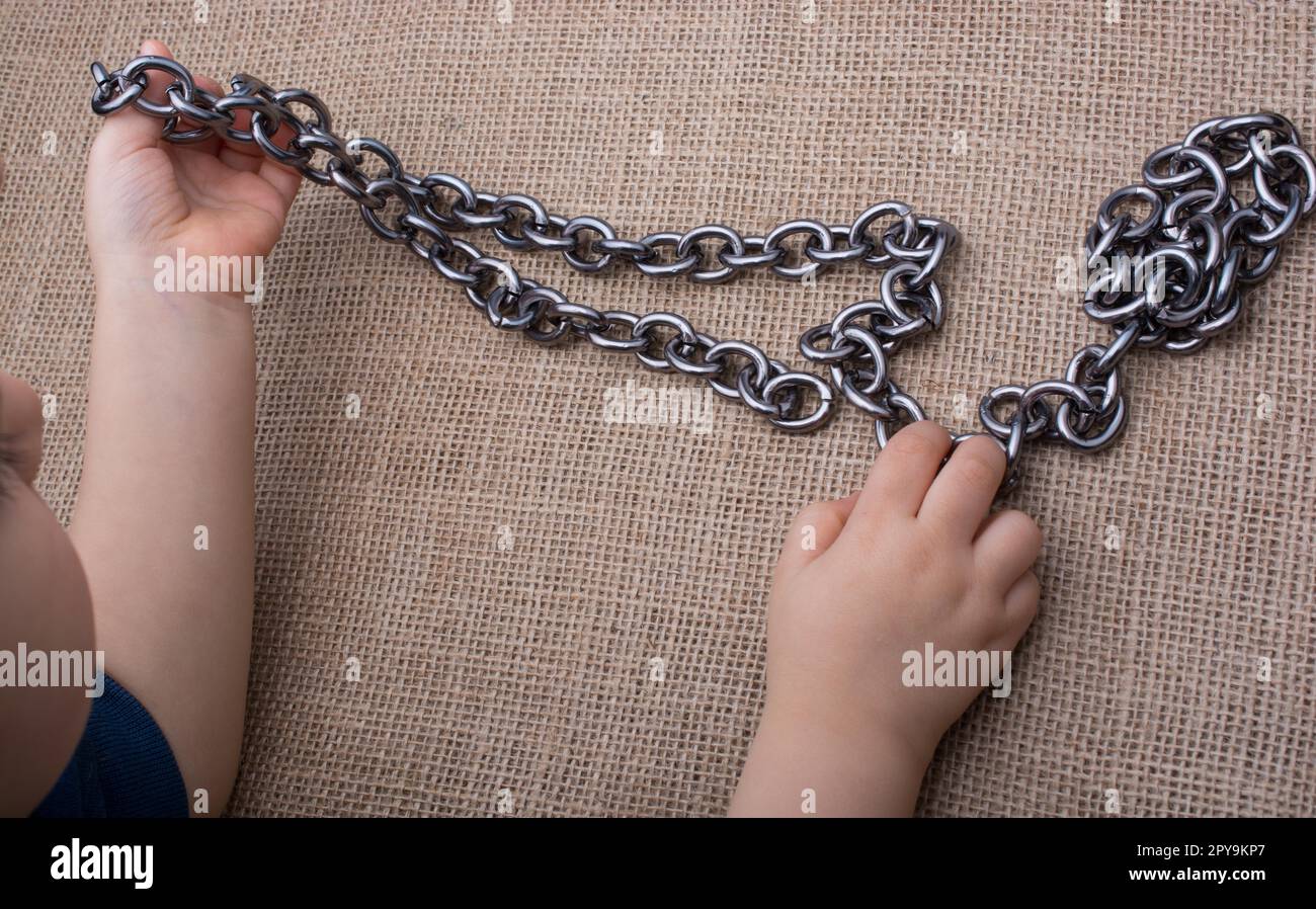 Hand on chain hi-res stock photography and images - Alamy