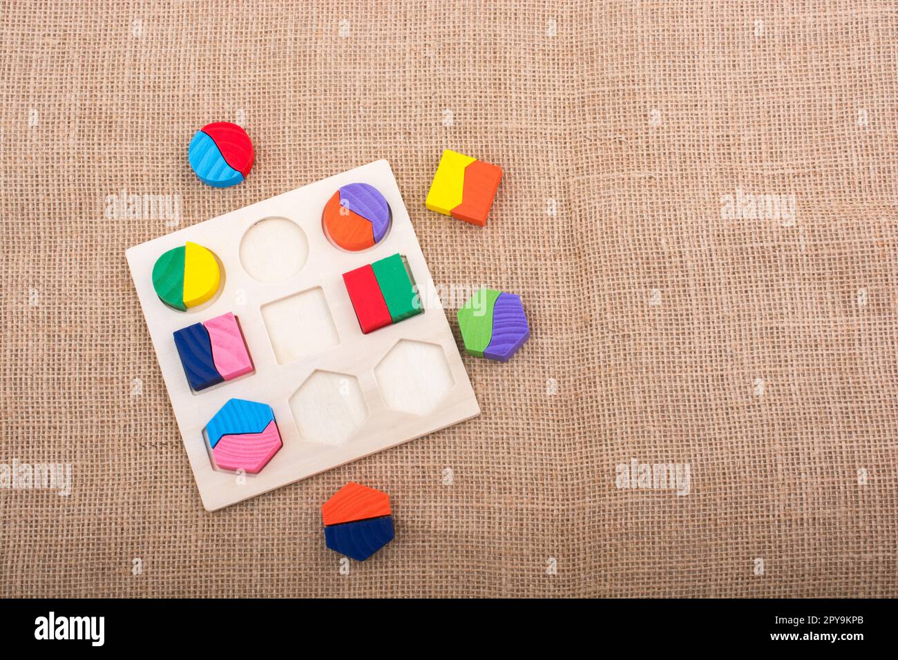 Colorful wooden pieces of a logic puzzle Stock Photo - Alamy