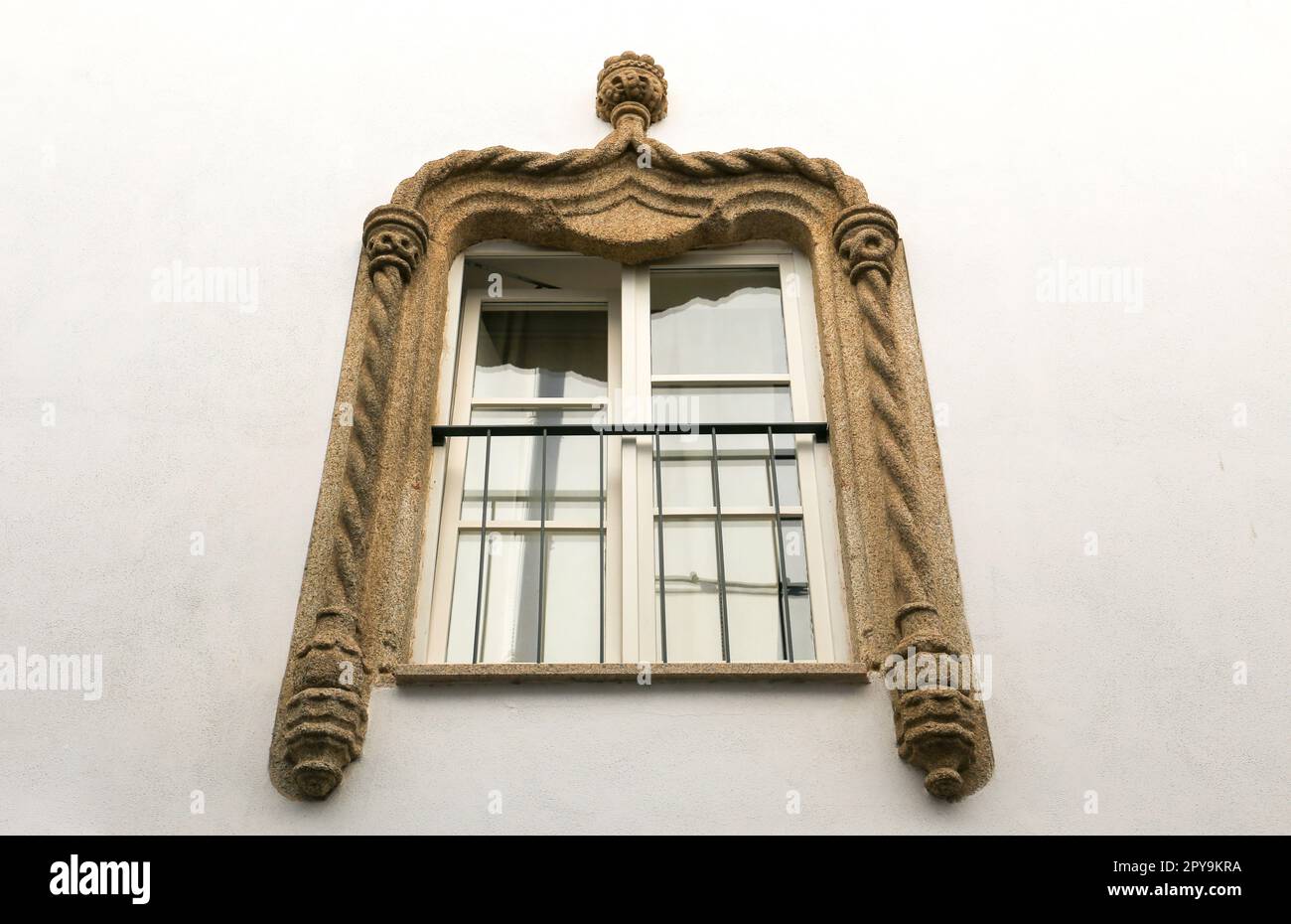 Typical Portuguese facade with arabic style window in Evora town Stock ...