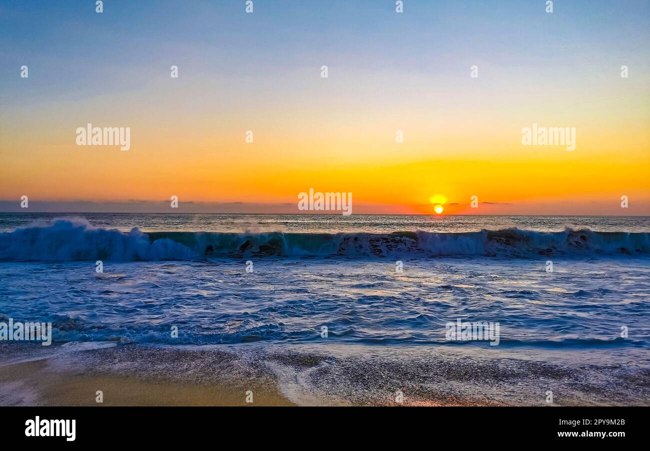 Colorful golden sunset big wave and beach Puerto Escondido Mexico Stock ...