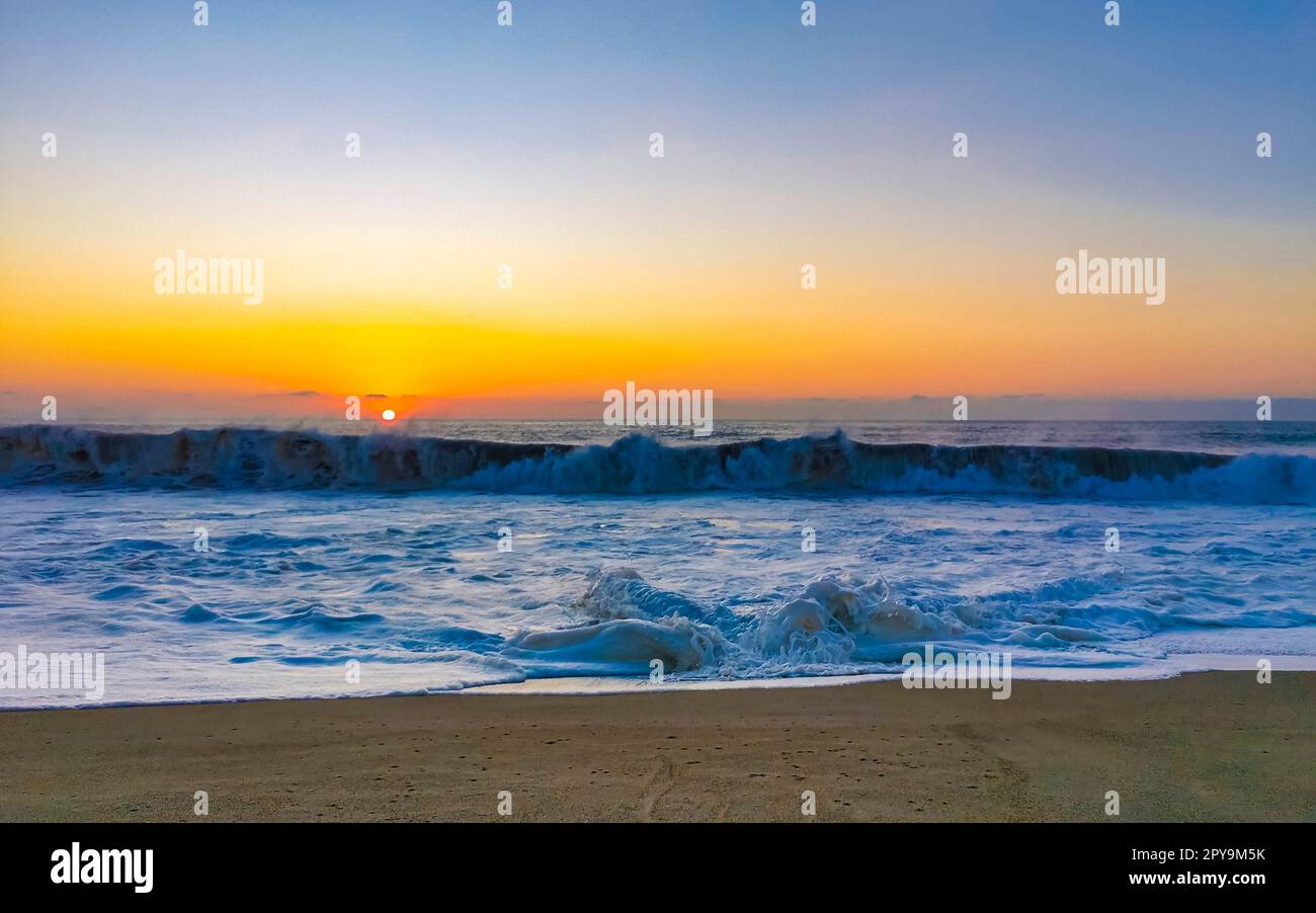Colorful golden sunset big wave and beach Puerto Escondido Mexico Stock ...