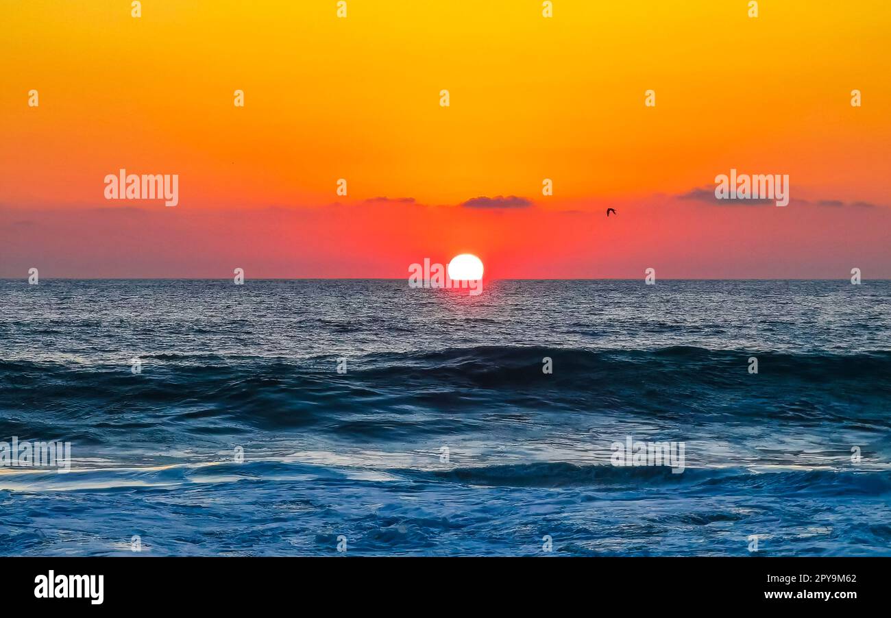 Colorful golden sunset big wave and beach Puerto Escondido Mexico Stock ...