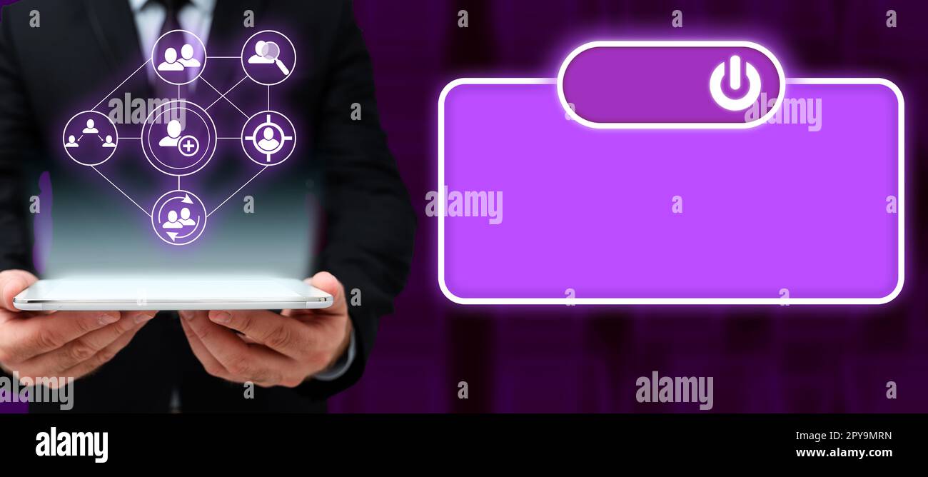 Businessman in black suit standing and holding tablet in two hands ...