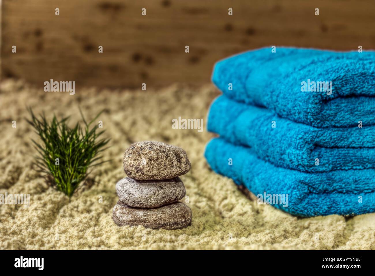 Decorating towels with 3 stones stacked on top of each other Stock ...