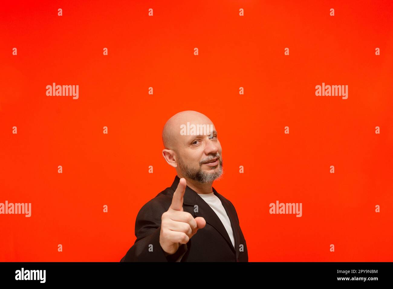 Portrait of a stylish business man making hand gestures. Looking at the ...