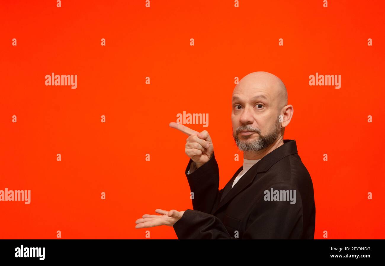 Portrait of a stylish business man making hand gestures. Looking at the ...