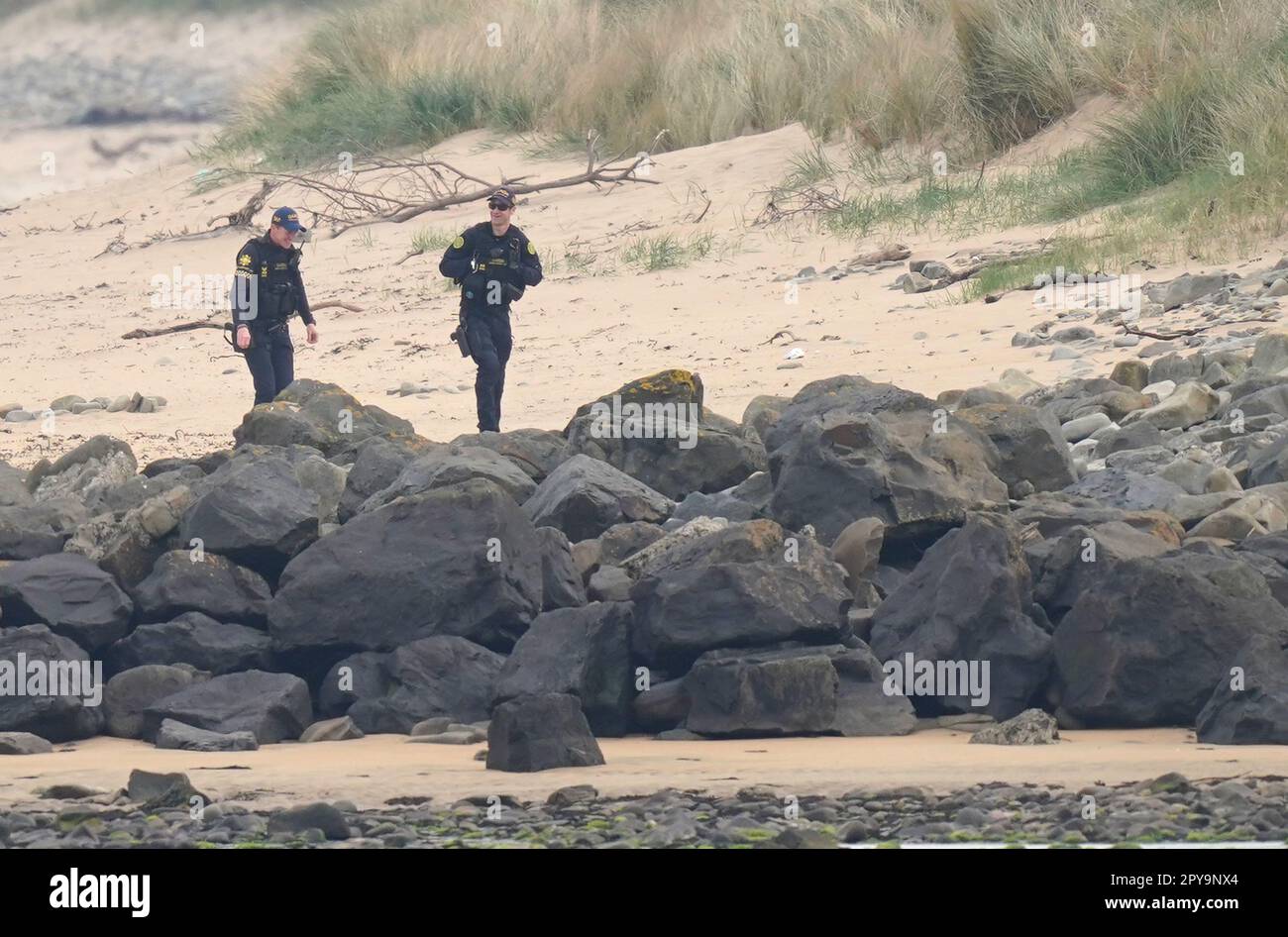 Armed Garda officers on Doonbeg beach near Trump International Golf ...