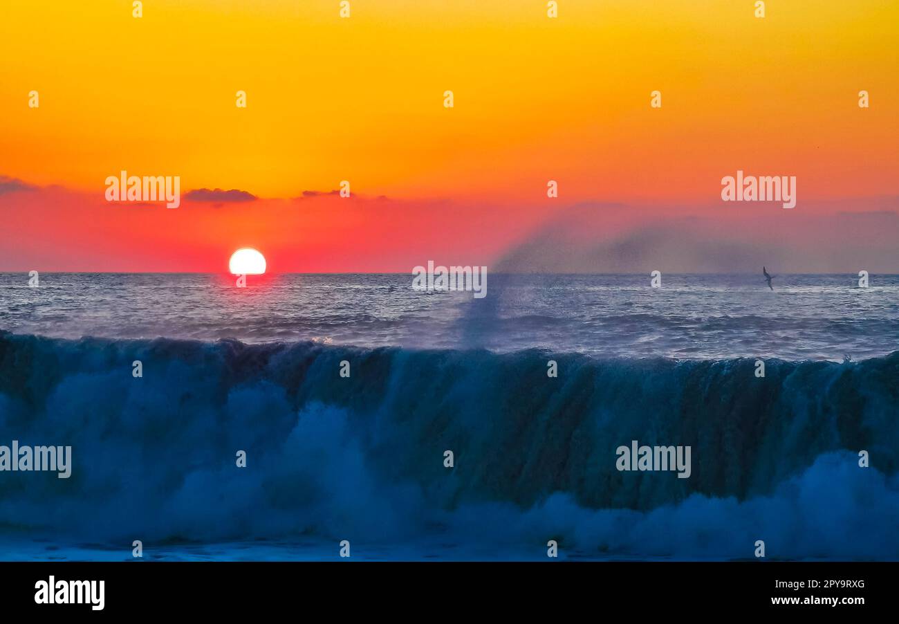 Colorful golden sunset big wave and beach Puerto Escondido Mexico Stock ...