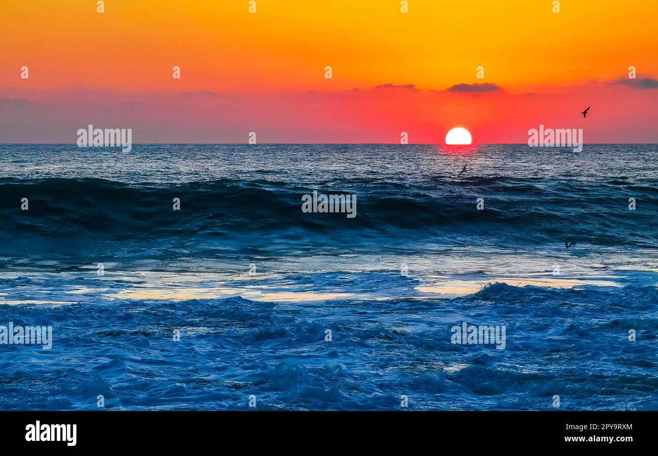 Colorful golden sunset big wave and beach Puerto Escondido Mexico Stock ...