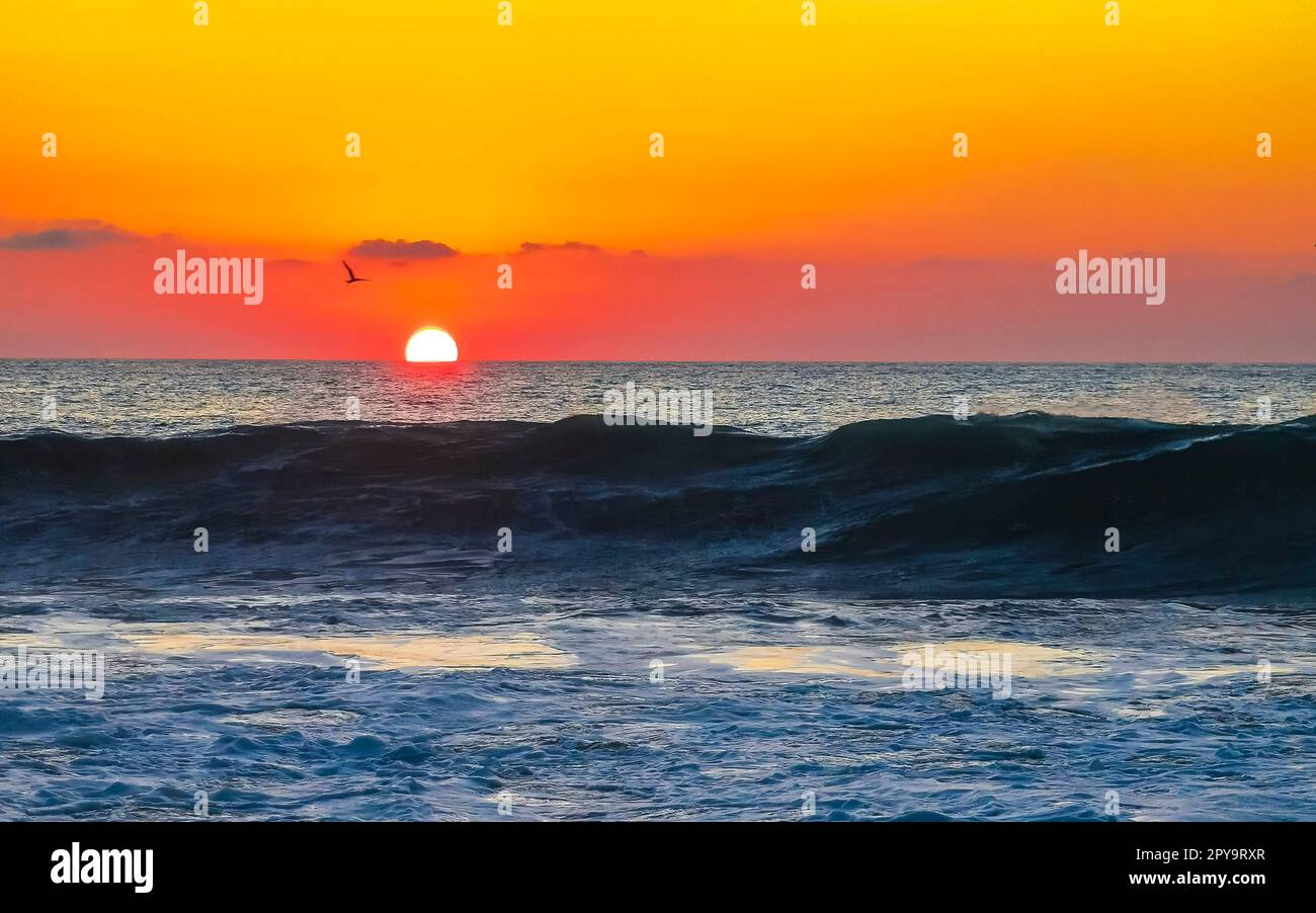 Colorful golden sunset big wave and beach Puerto Escondido Mexico Stock ...