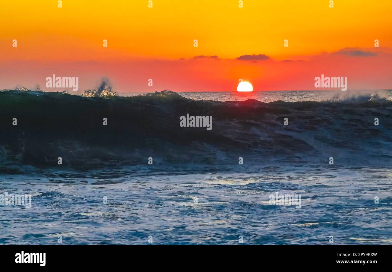 Colorful golden sunset big wave and beach Puerto Escondido Mexico Stock ...