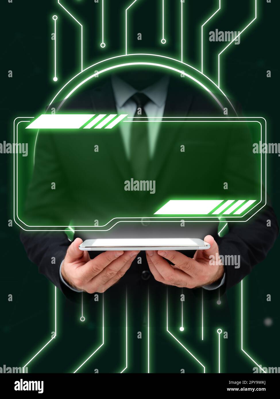 Businessman in black suit standing and holding tablet in two hands ...