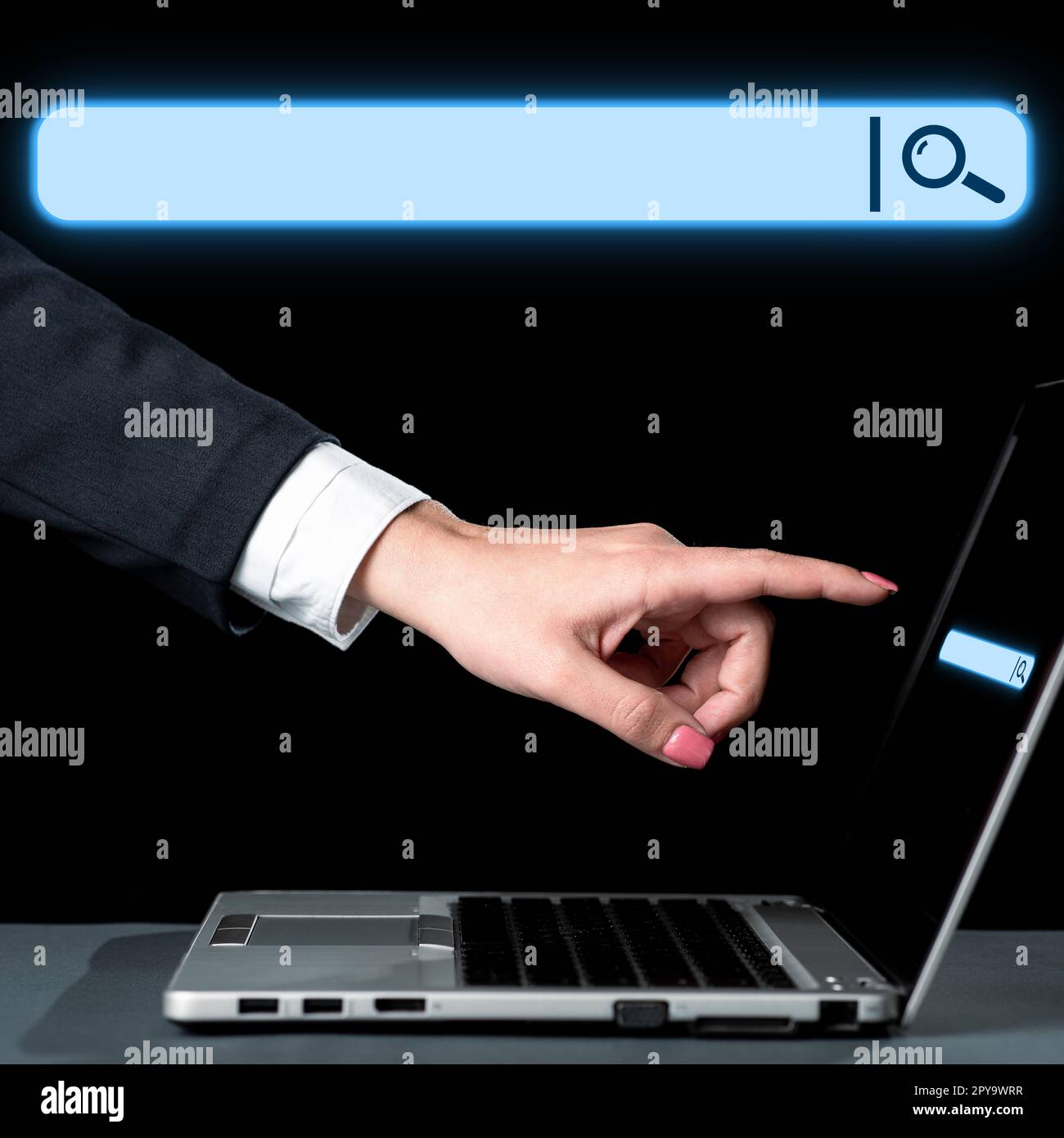 Finger pointing to laptop screen with important technology news ...
