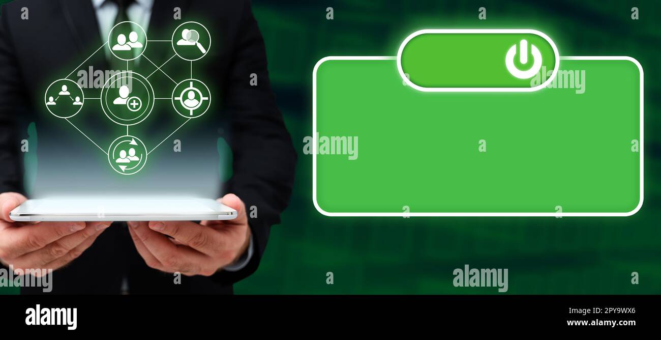 Businessman in black suit standing and holding tablet in two hands ...