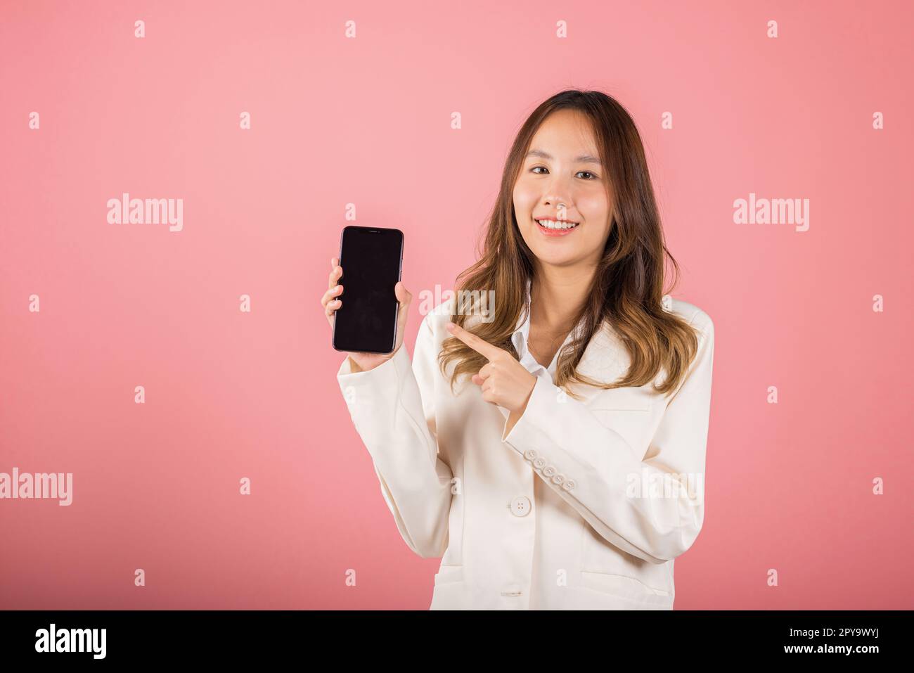 young woman smile making finger pointing on screen smartphone Stock ...