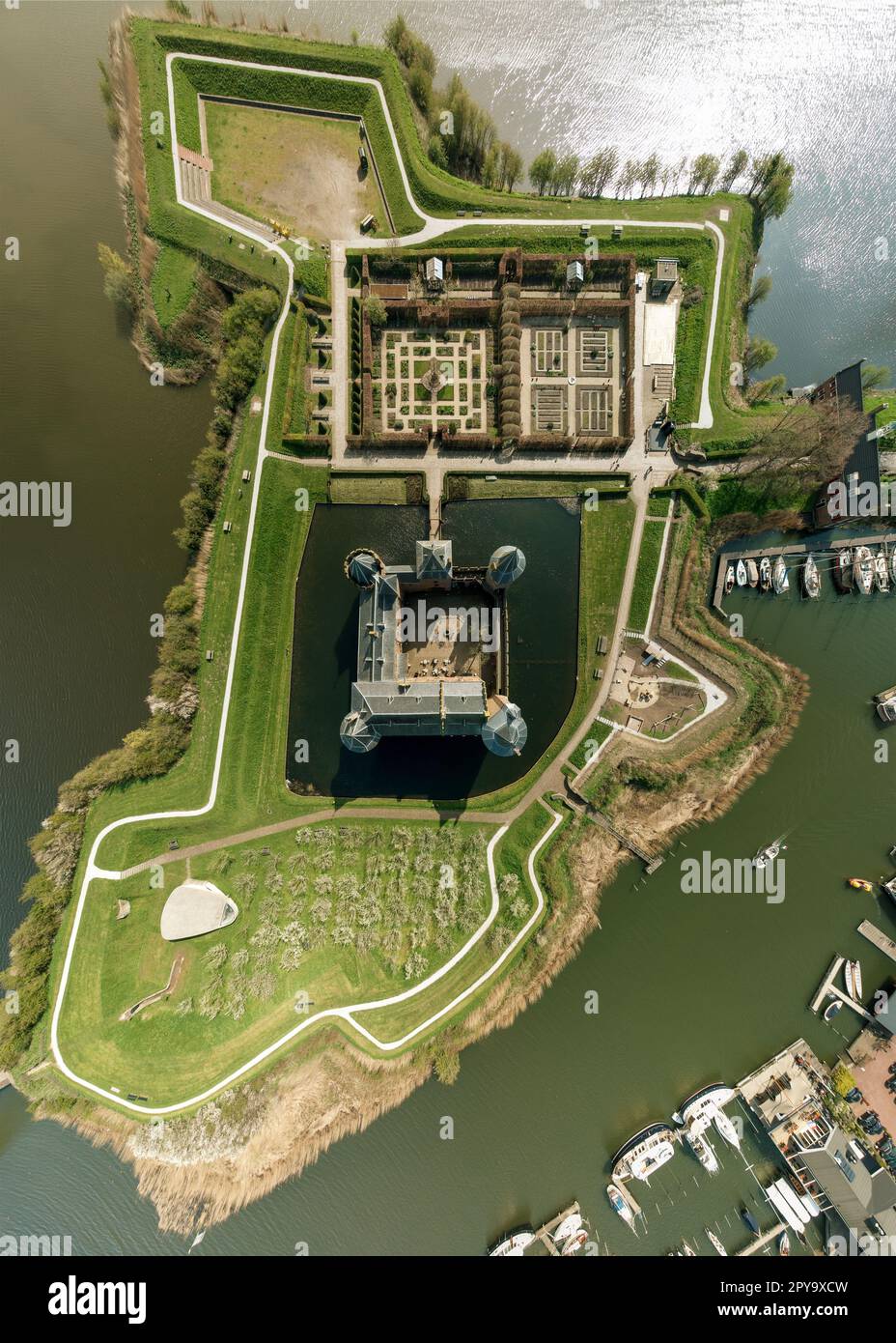 Muiden Castle in Netherlands. Medieval fortress surrounded by a moat ...