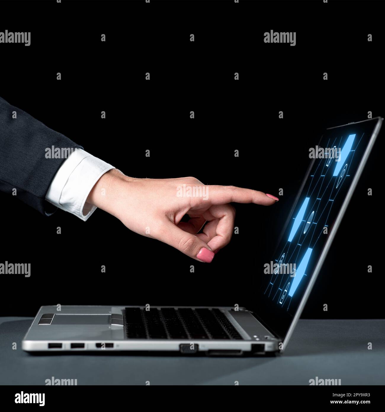 Finger pointing to laptop screen with important technology news ...