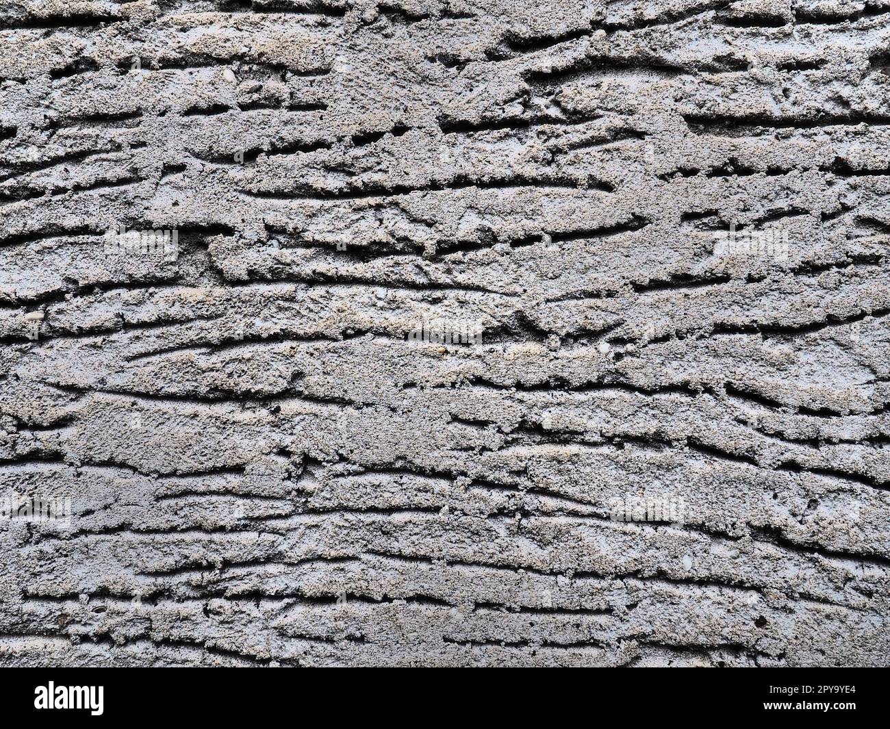 Texture of concrete and plaster on the wall. Drips on the wall. Wavy ...