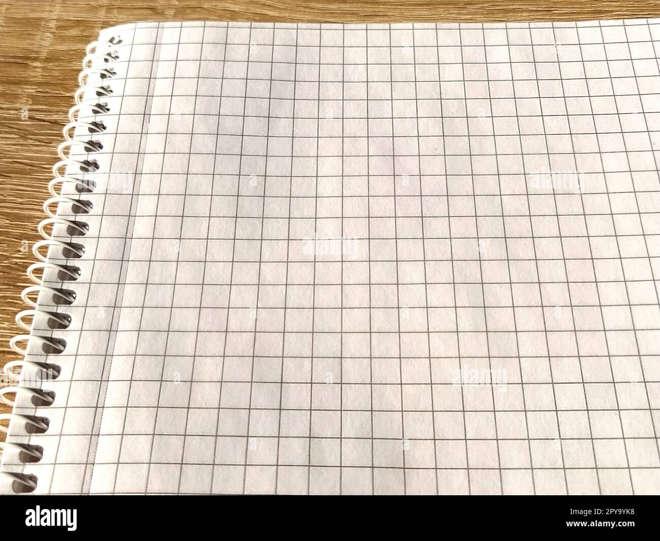 Checkered notebook with spiral. An open notepad for notes. Soft focus ...