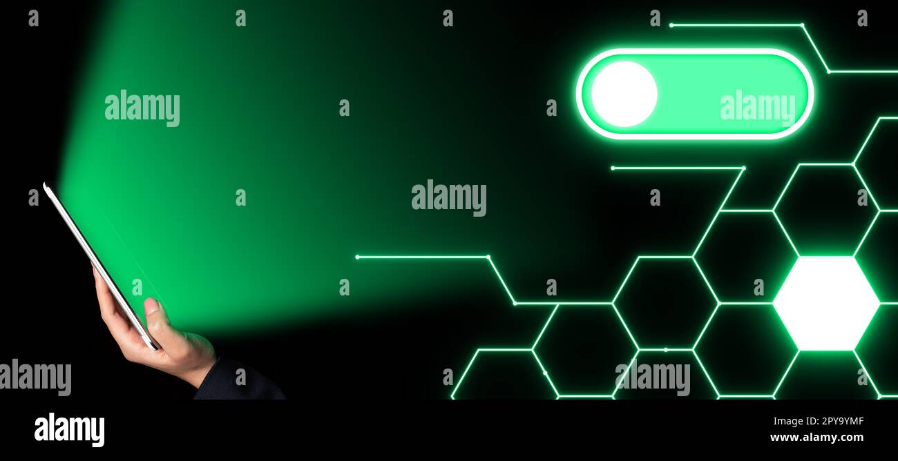 Hand holding Mobile Phone with glow from the screen. Display Receiving ...