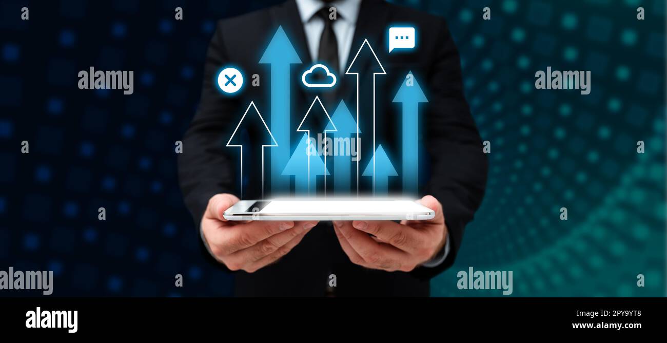 Businessman in black suit standing and holding tablet in two hands ...