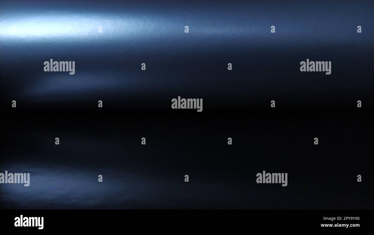 Gradient on a dark blue background. Horizontally folded shiny paper or ...