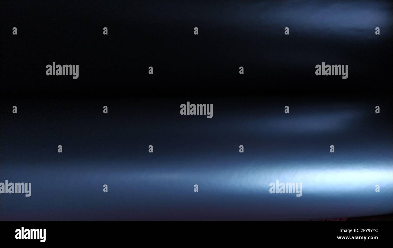 Gradient on a blue-violet background. Horizontally folded shiny paper ...