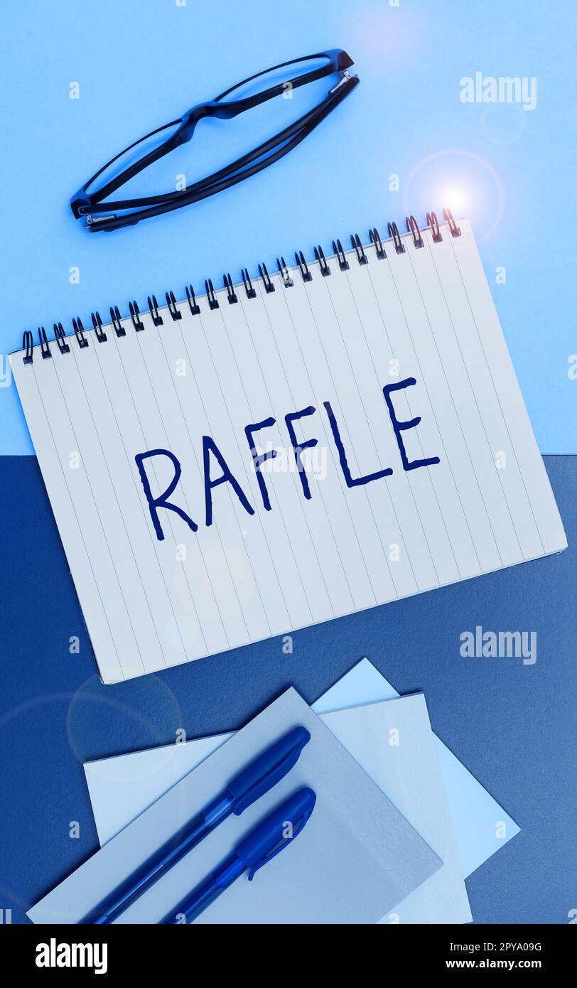 Conceptual caption Raffle. Word Written on means of raising money by ...
