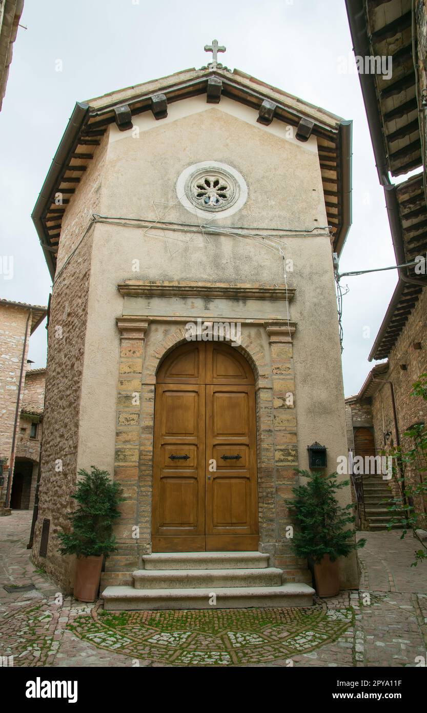 Facade of a little church in the medieval village of Collepino in ...