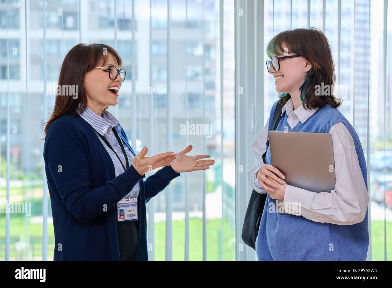 Meeting, conversation of female teacher and girl college student in ...