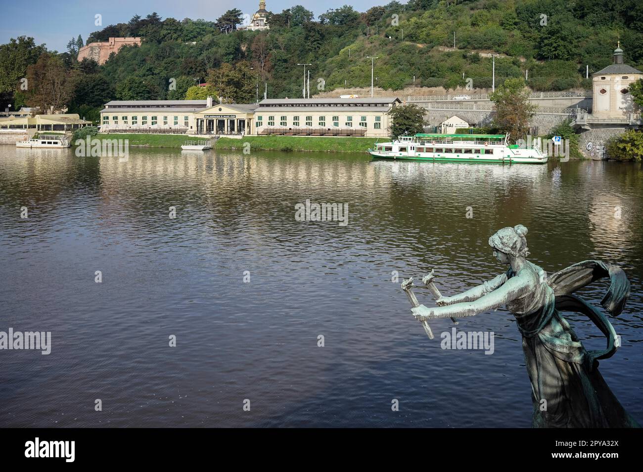 Statue of a woman with torches on the Cechuv Bridge in Prague Stock ...