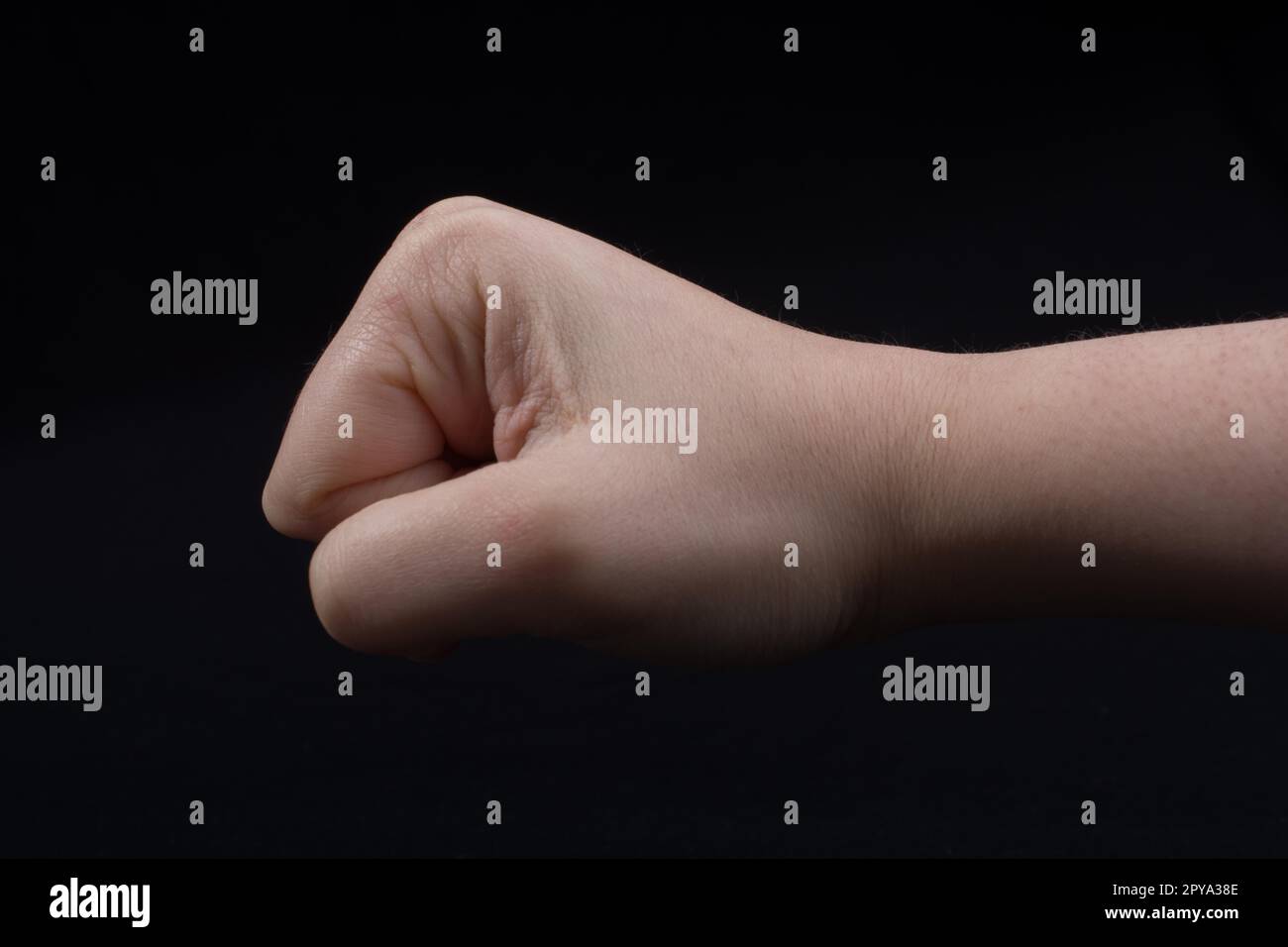Hand closed for a fist gesture in black Stock Photo - Alamy