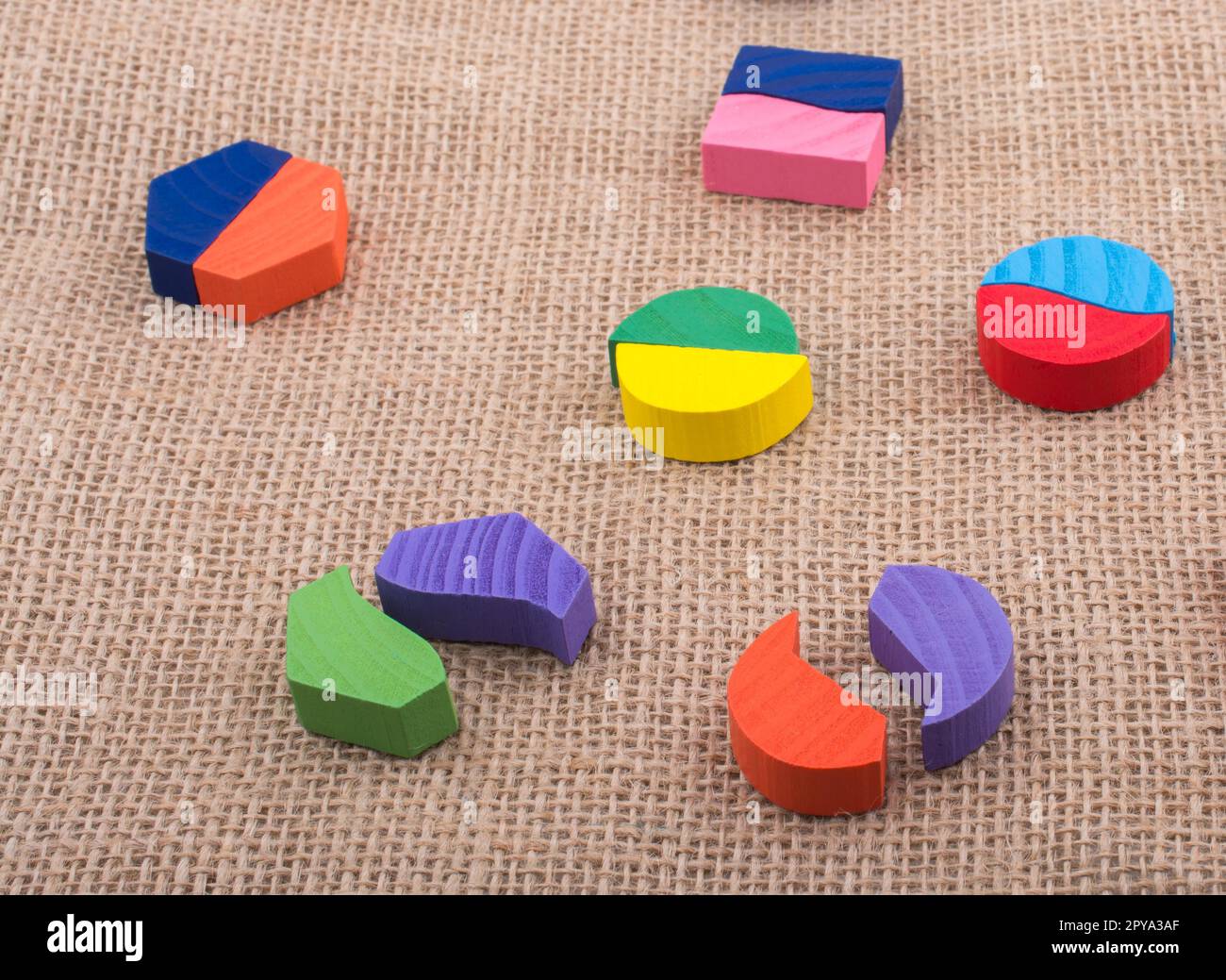 Colorful wooden pieces of a logic puzzle Stock Photo - Alamy