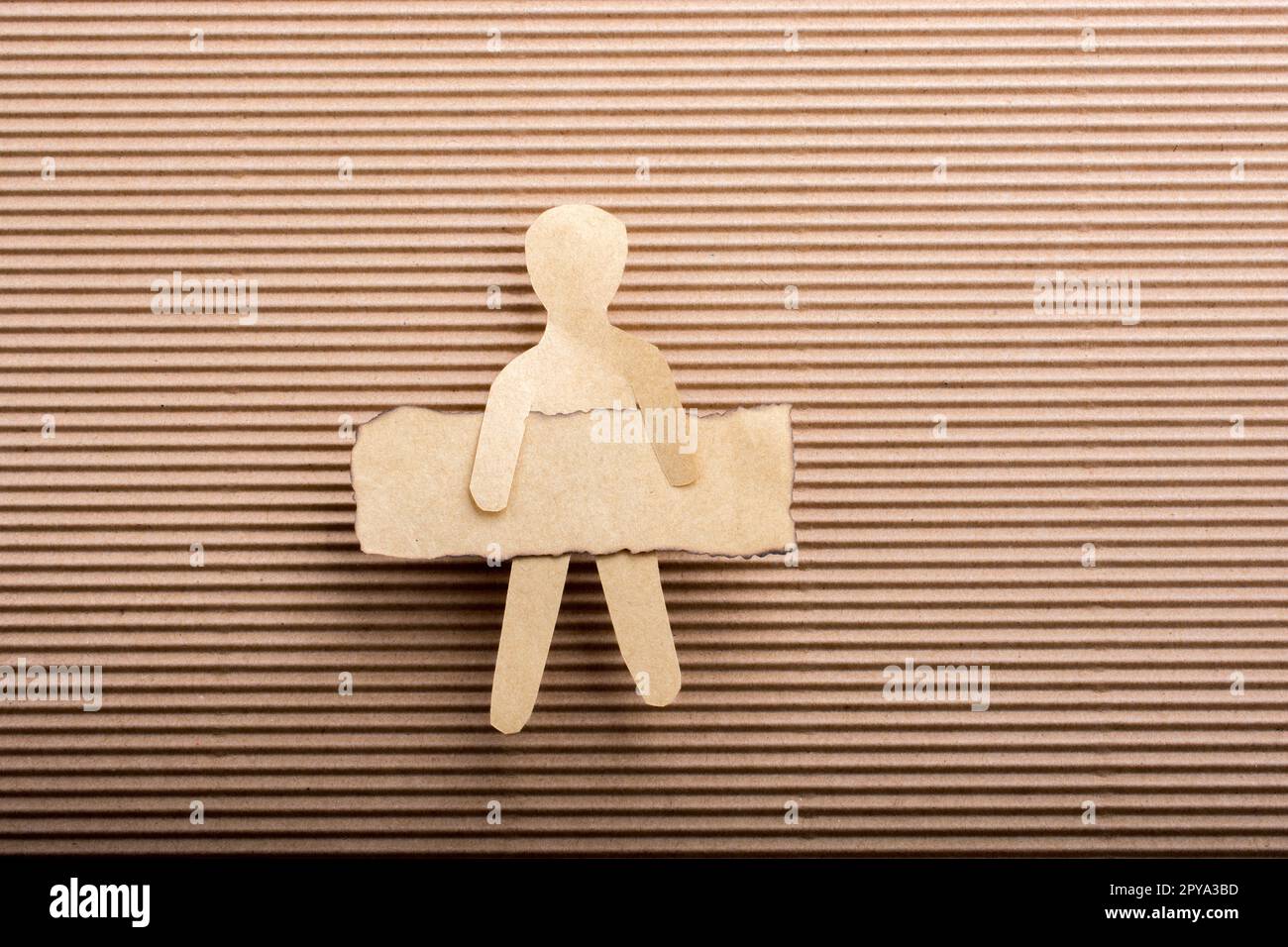 Paper man shape holding burnt note paper in hand Stock Photo - Alamy