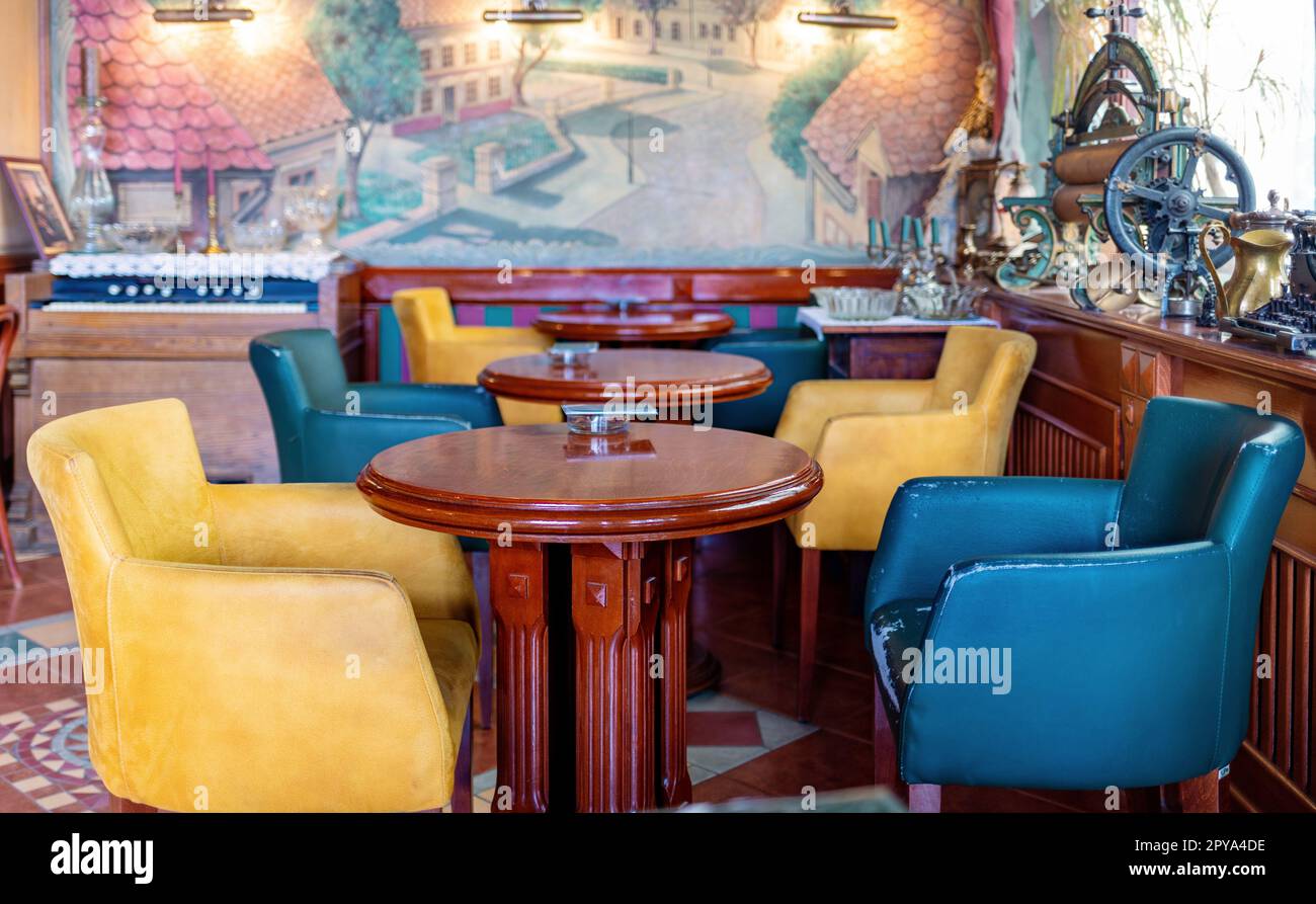 Vintage coffee shop interior with beautiful blue and yellow armchairs ...