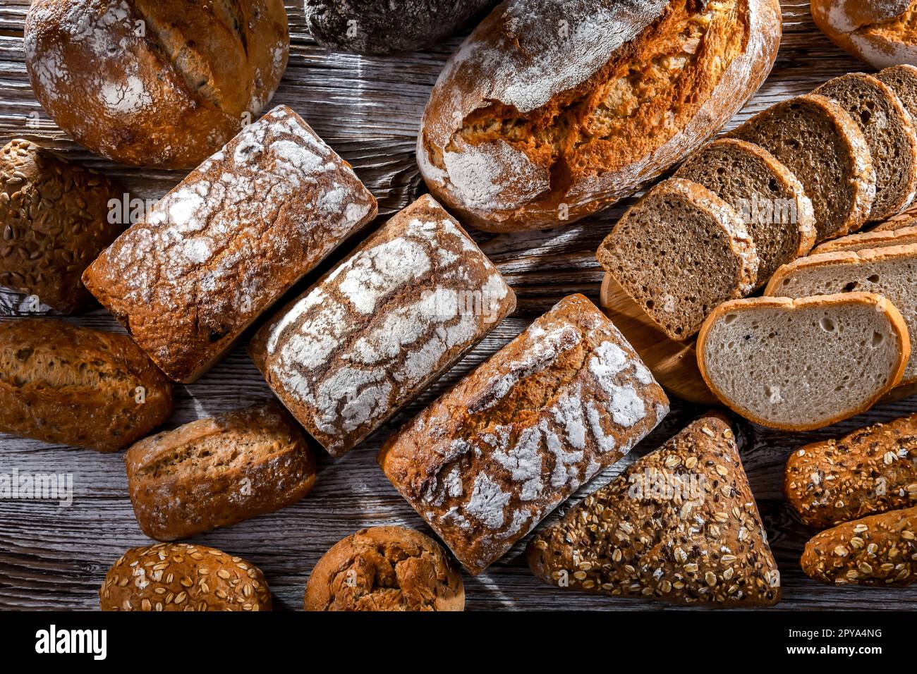 Assorted bakery products including loaves of bread and rolls Stock ...
