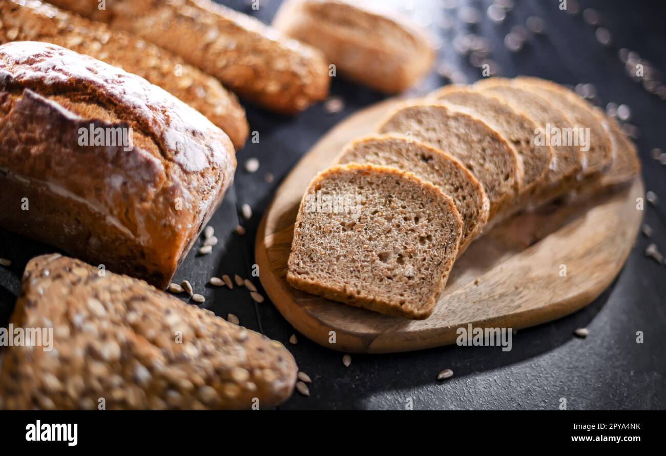 Assorted bakery products including loaves of bread and rolls Stock ...