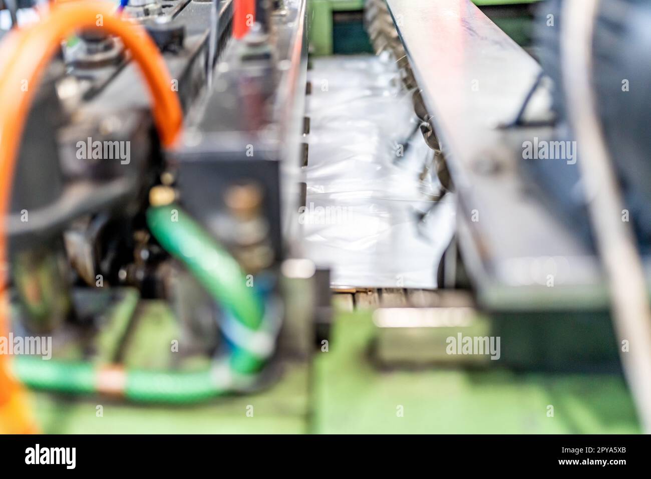 Plastic packaging conveyor hi-res stock photography and images - Alamy