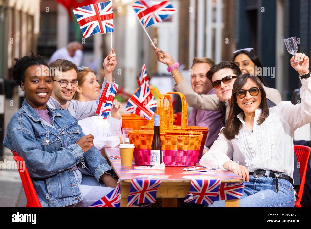 EDITORIAL USE ONLY Guests sit at an 80 foot-long banquet table in ...