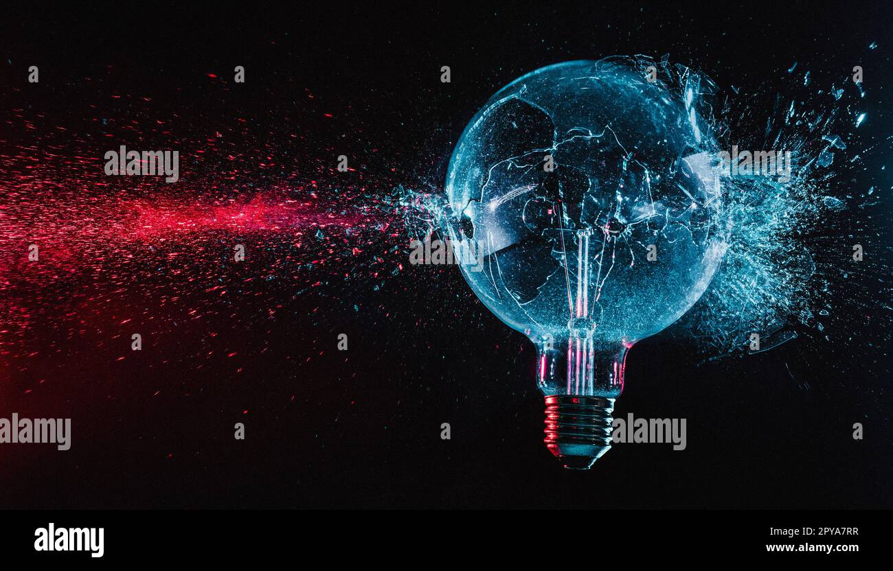 large blue bulb shatters and creates fragments of red glass Stock Photo ...