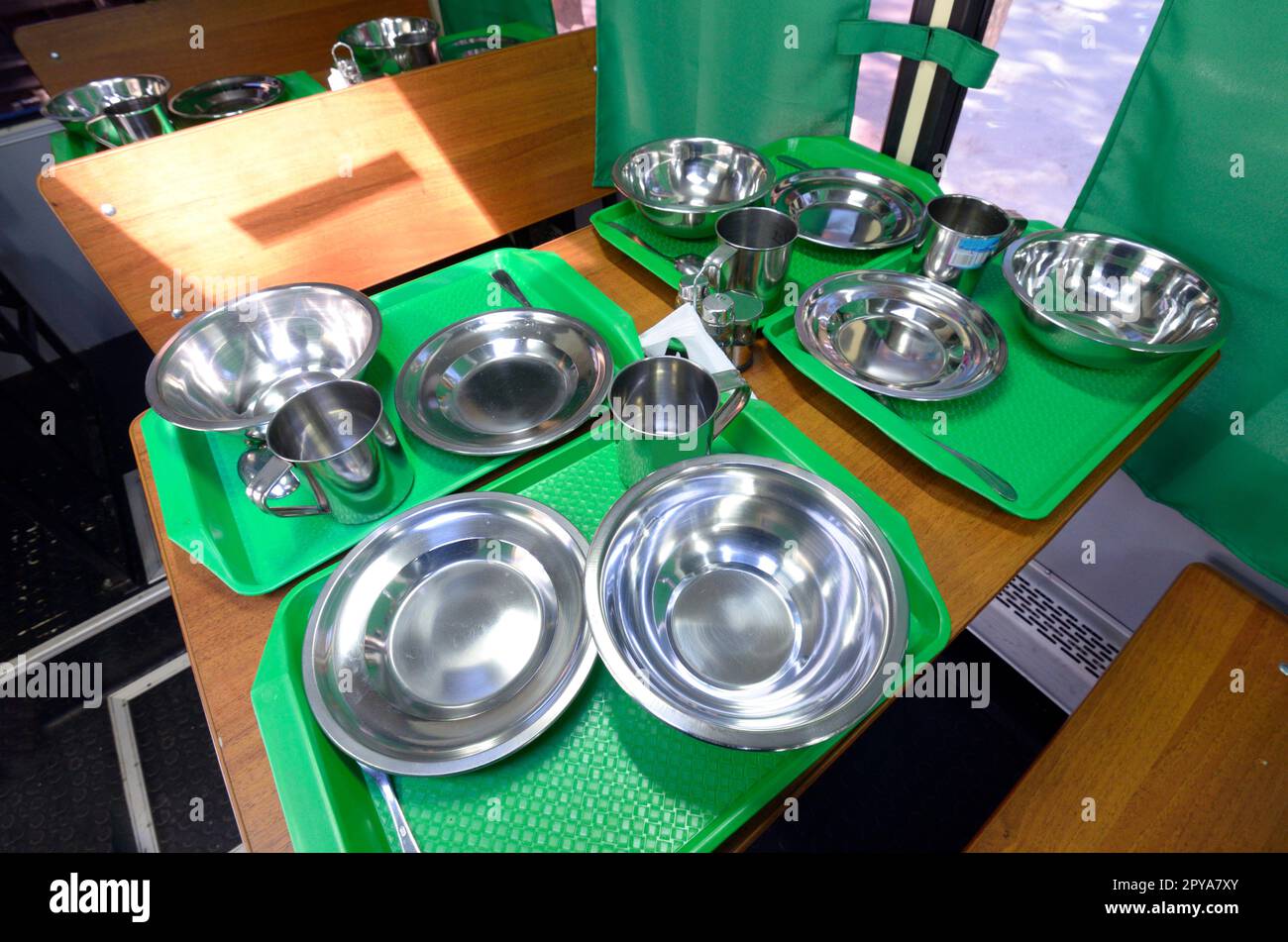 Tables served with metal tableware in the mobile canteen for soldiers ...