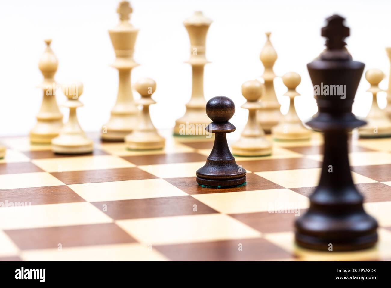 black pawn and single queen against white chess Stock Photo - Alamy