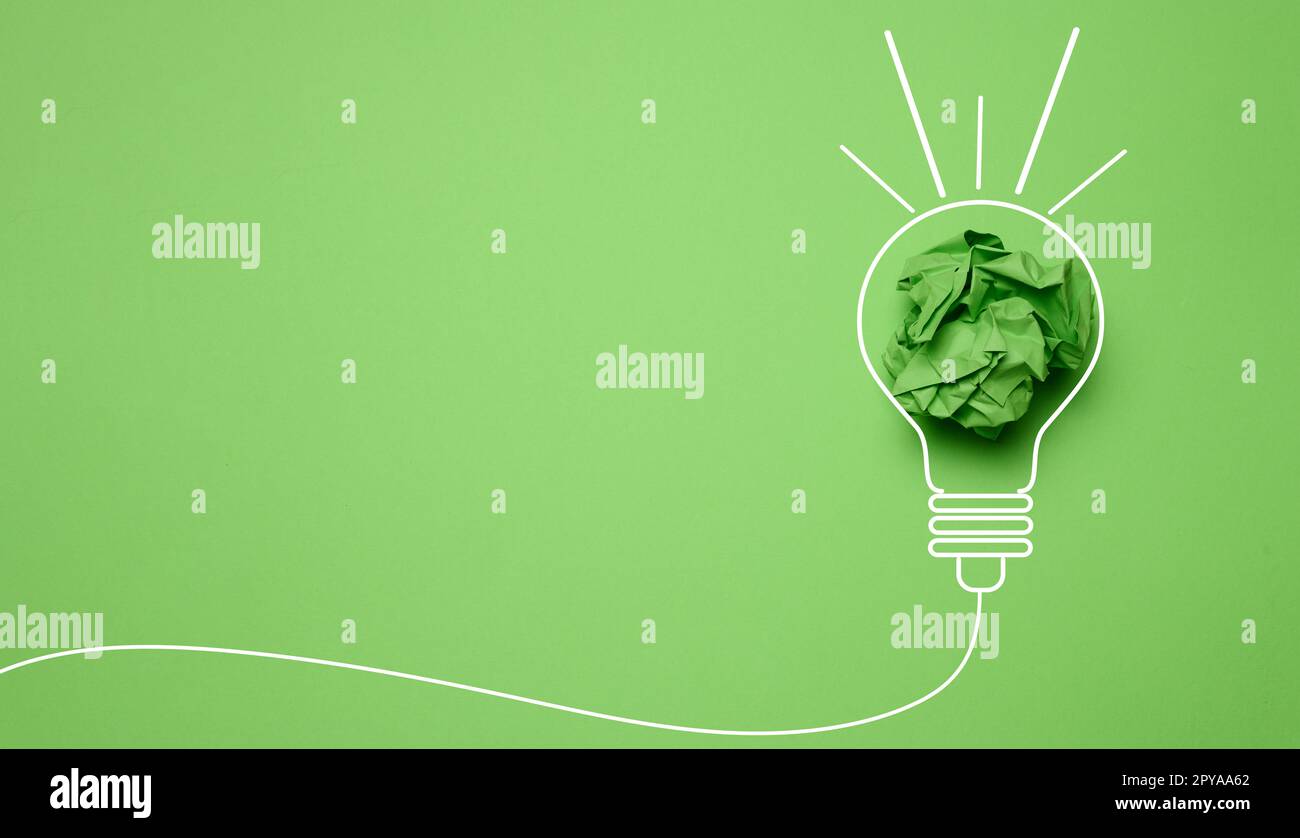 Crumpled paper sheet inside a drawn light bulb, concept of new creative ...
