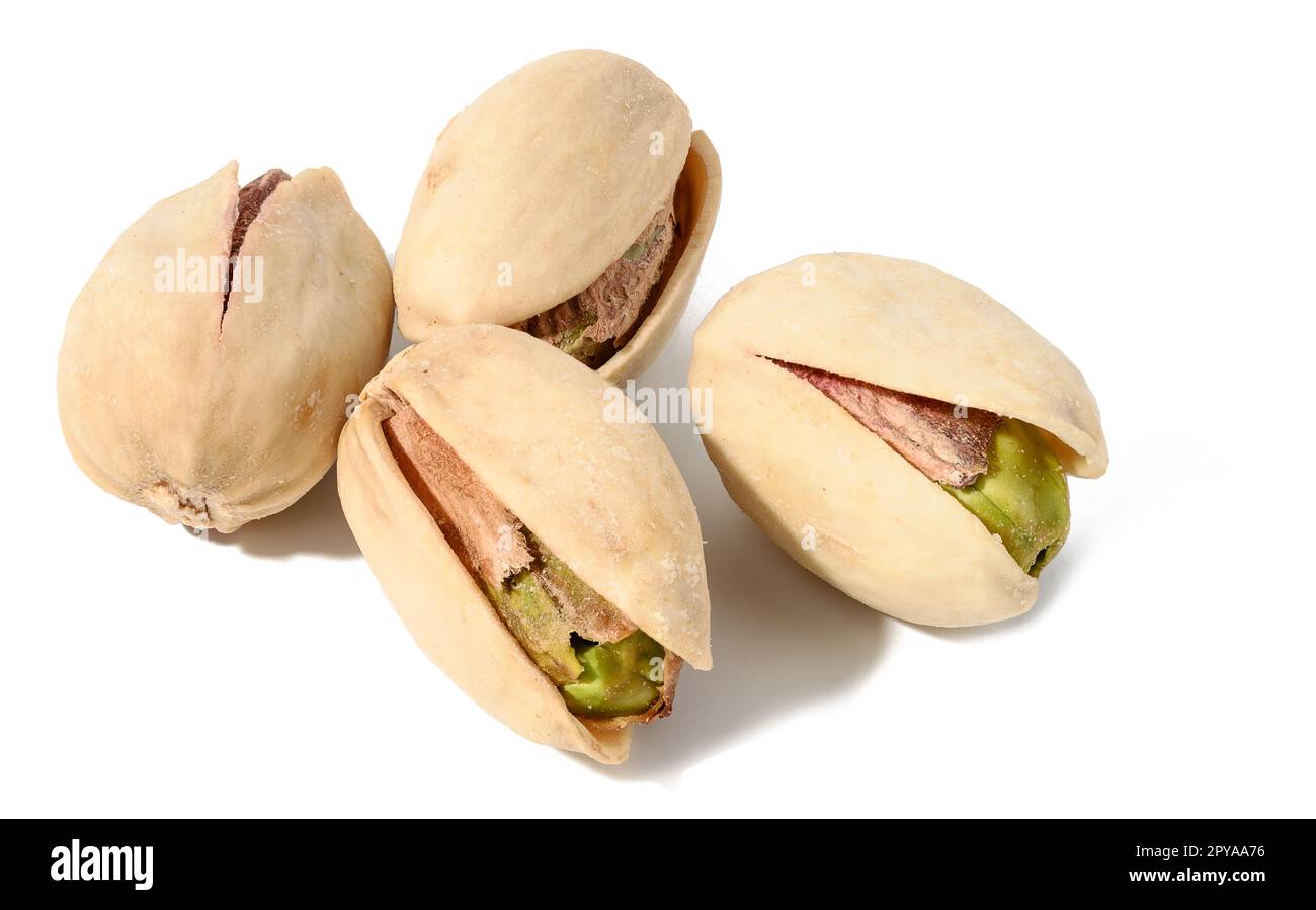 Fried salted pistachios in shell on white isolated background ...